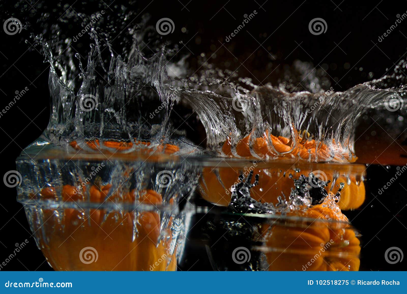 Pumpkin falling in water stock image. Image of transparent - 102518275