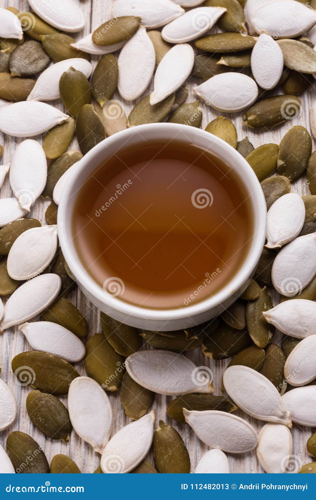 Pumpkin Seed Oil on a Rustic Background Stock Image - Image of ...