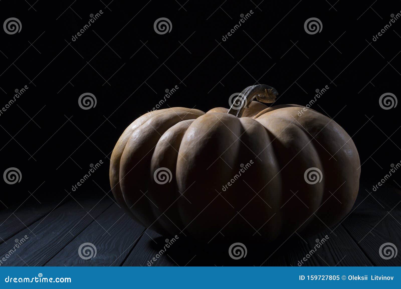 Pumpkin on a Wooden Table Black Background Side View. Halloween ...