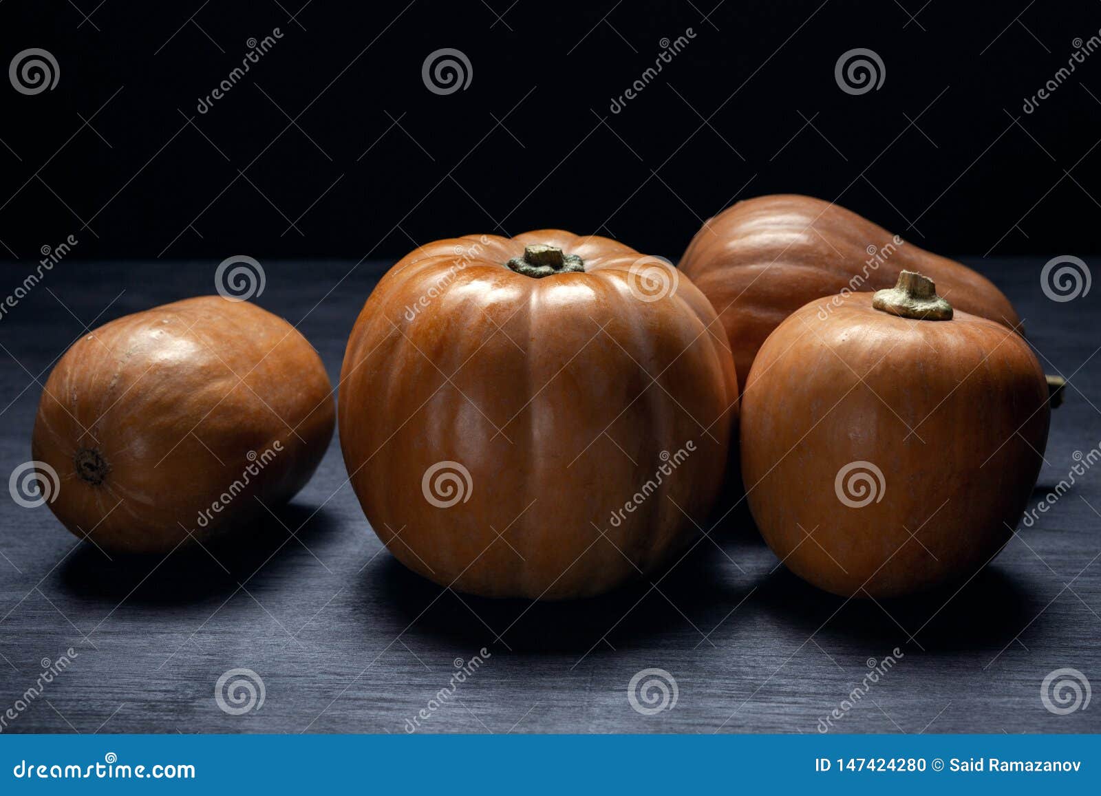 Pumpkins on Dark Wooden Background Side View Stock Photo - Image of ...