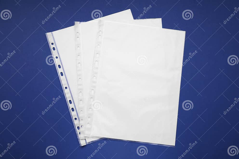 Punched Pockets with Paper Sheets on Blue Background, Flat Lay. Space ...