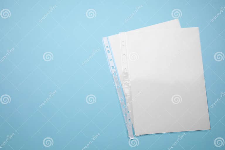 Punched Pockets with Paper Sheets on Turquoise Background, Flat Lay ...