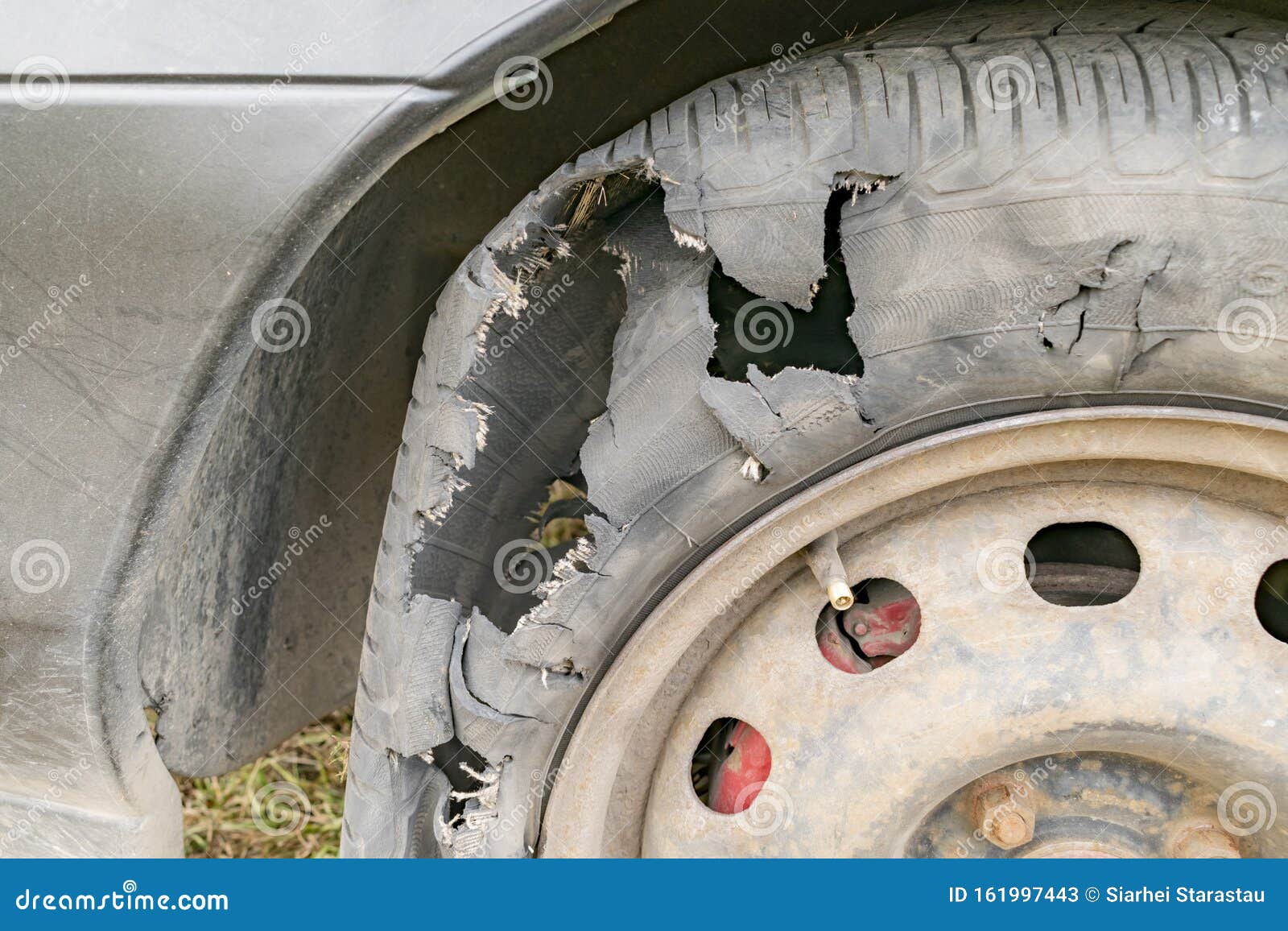 The Punched and Torn Tire of a Wheel Stock Image - Image of dirty ...