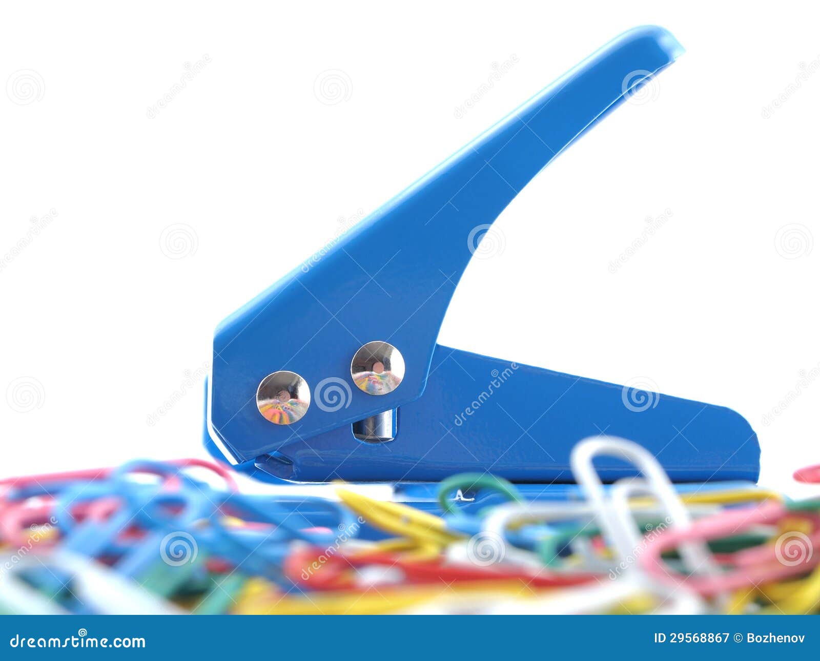 Puncher behind paper clips stock image. Image of tool - 29568867