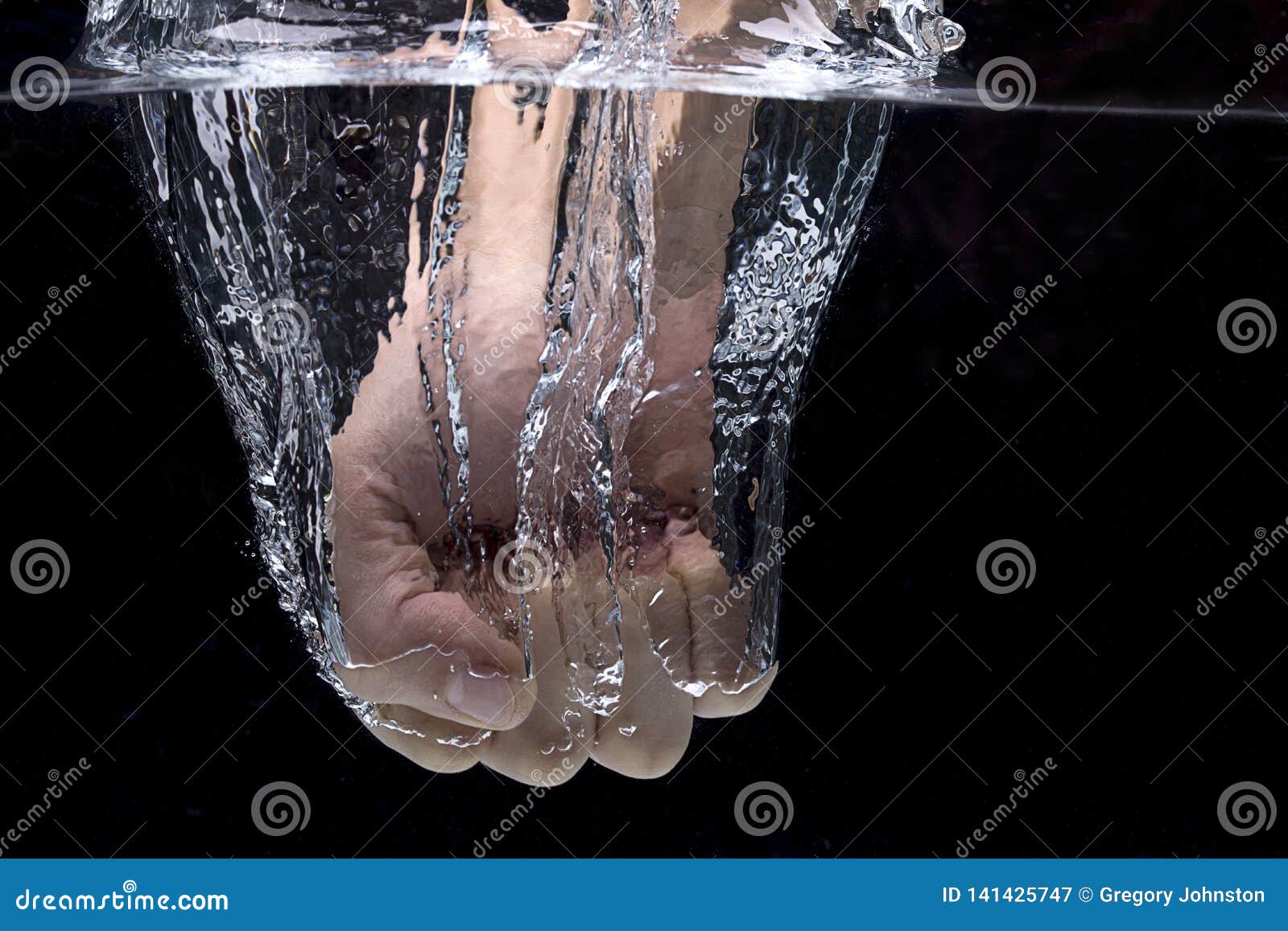 Punching into the water. stock image. Image of force - 141425747