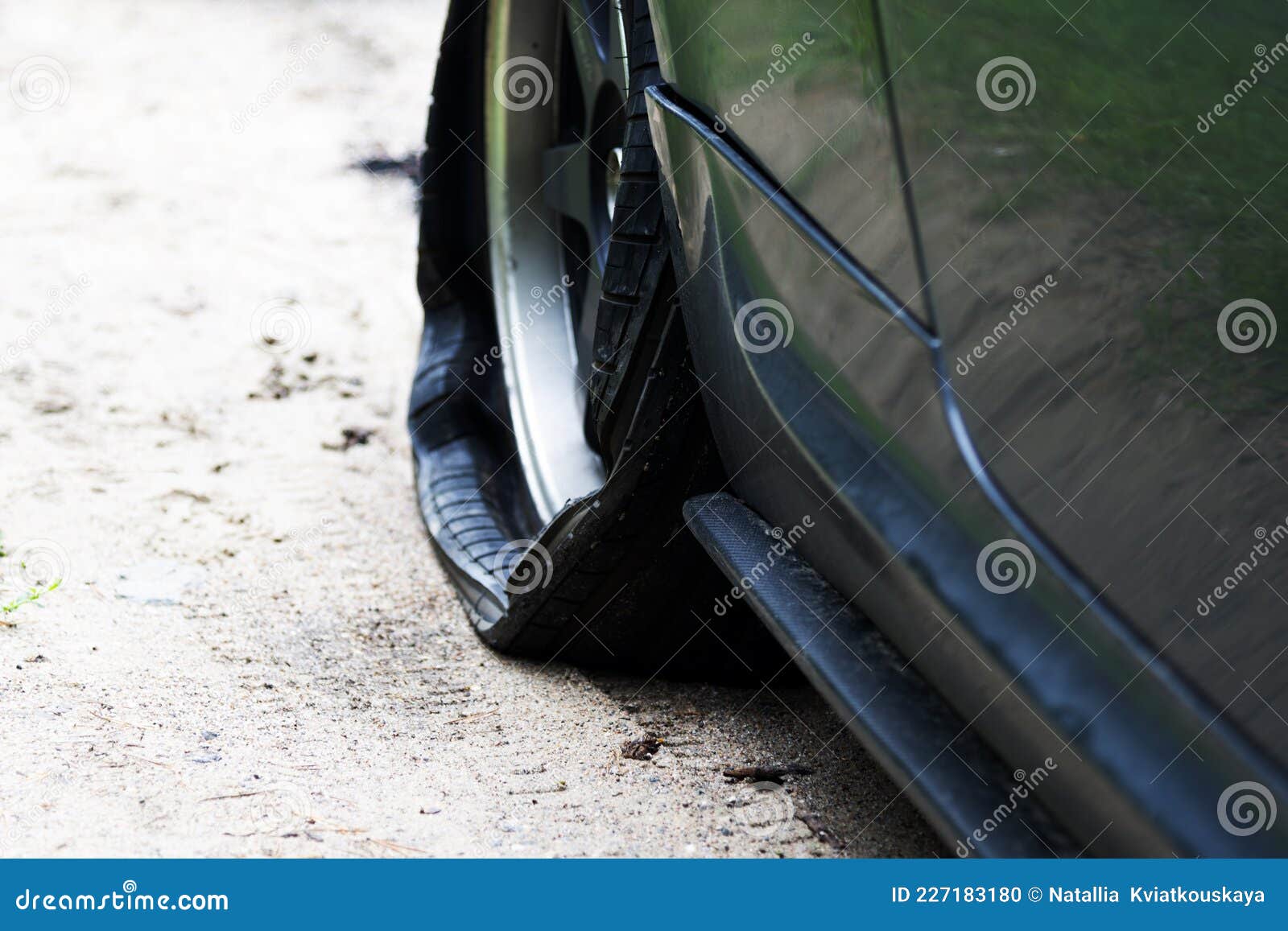 Punctured Wheel of a Modern Car on the Road. Car Tire Puncture Stock ...