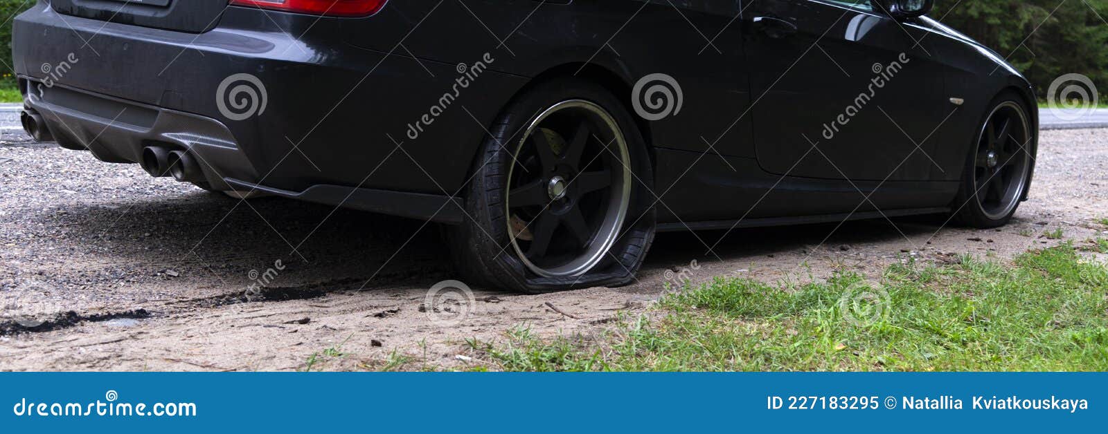 Punctured Wheel of a Modern Car on the Road. Car Tire Puncture Stock ...