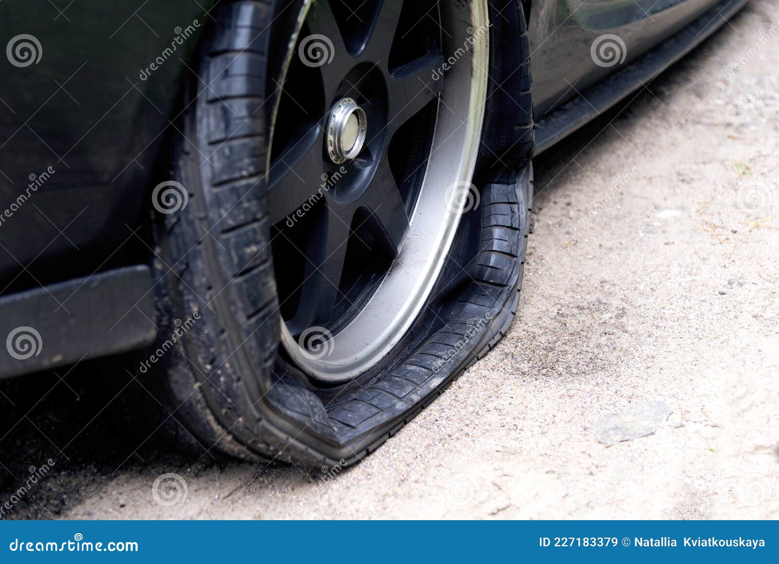 Punctured Wheel of a Modern Car on the Road. Car Tire Puncture Stock ...