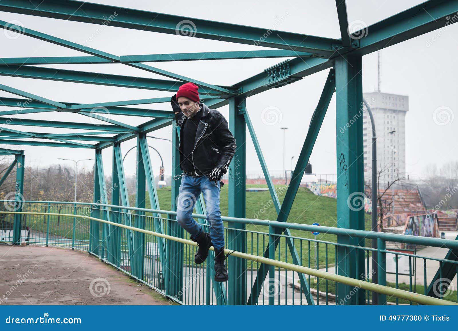 Punk Guy Jumping on a Bridge Stock Photo - Image of alternative, boots ...