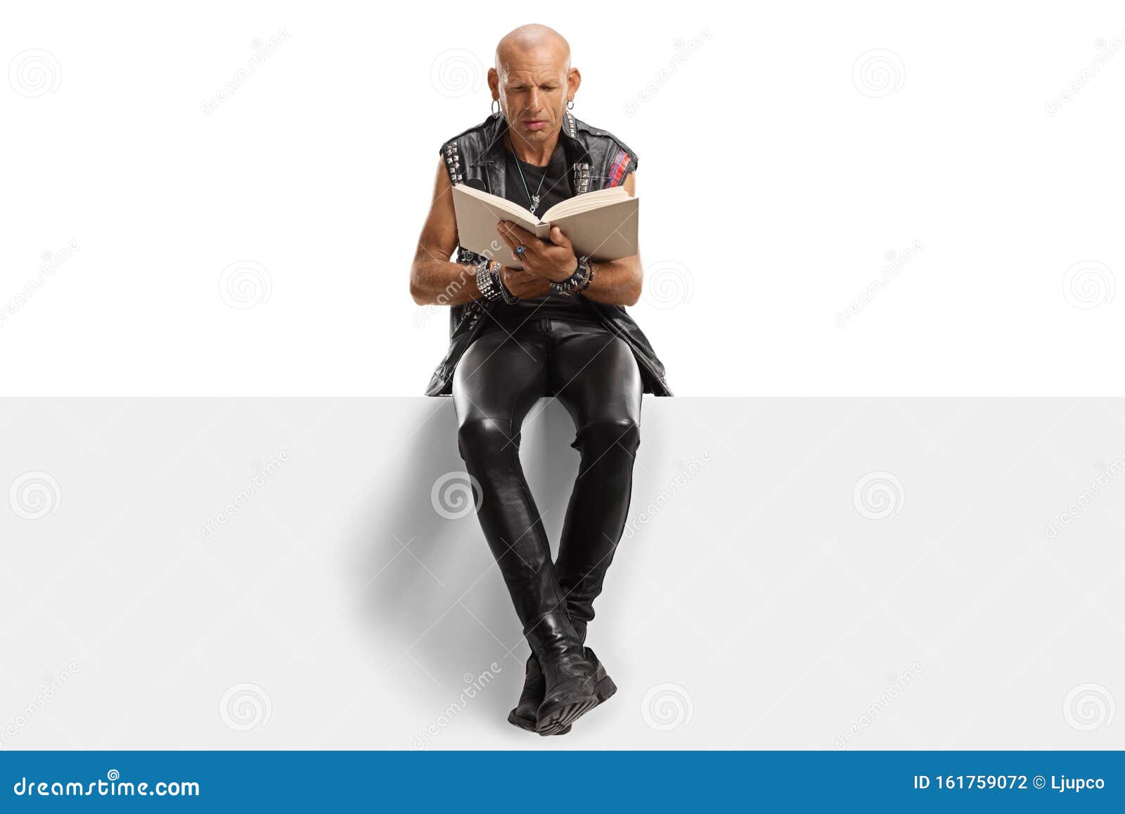 Punker Sitting on a Panel and Reading a Book Stock Photo - Image of ...