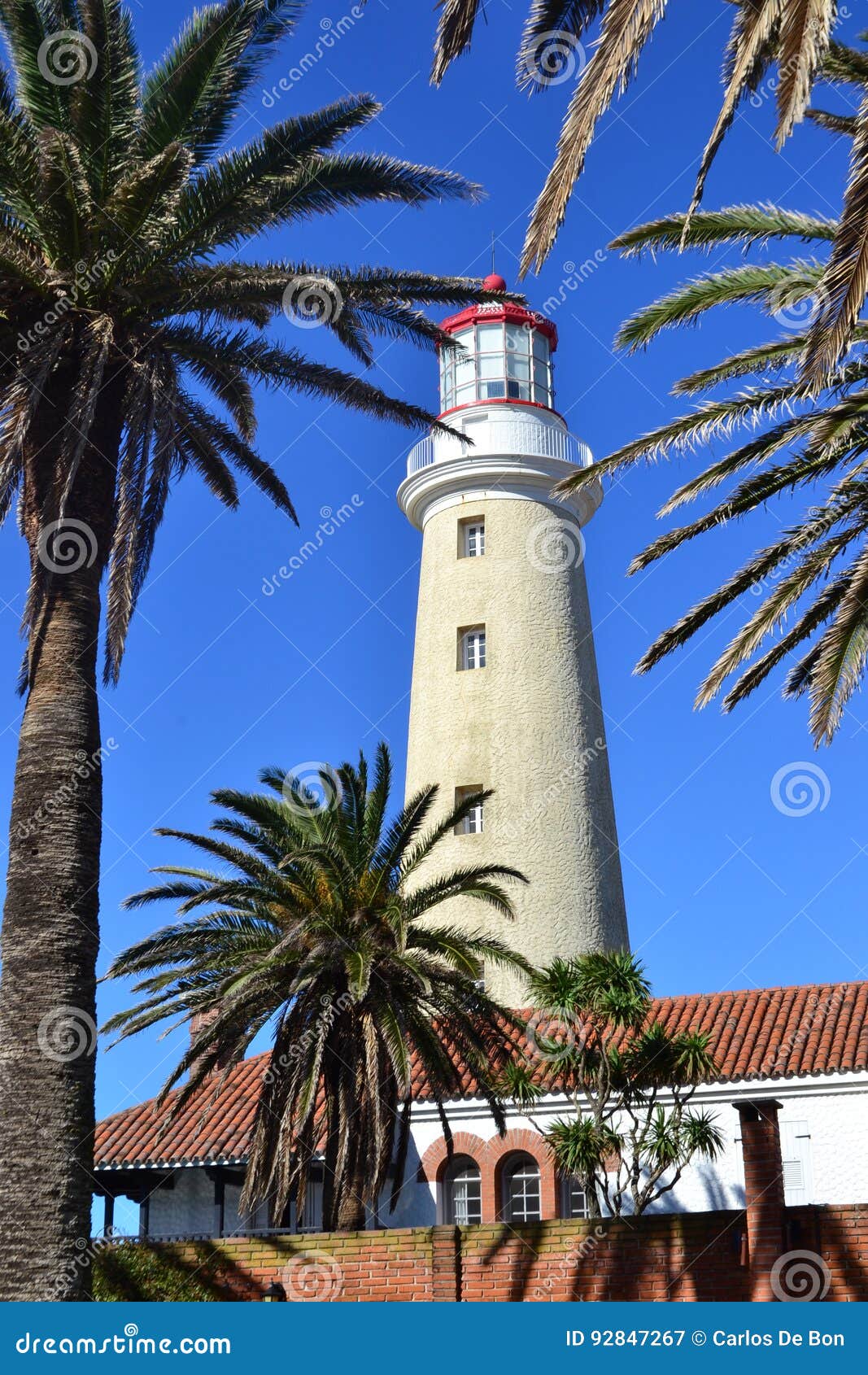 Punta del este lighthouse stock image. Image of palms - 92847267