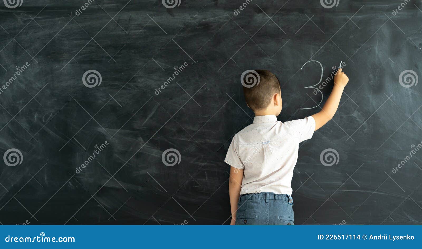 Pupil in Class at a Math Lesson Writes on a Chalk Board with Chalk ...