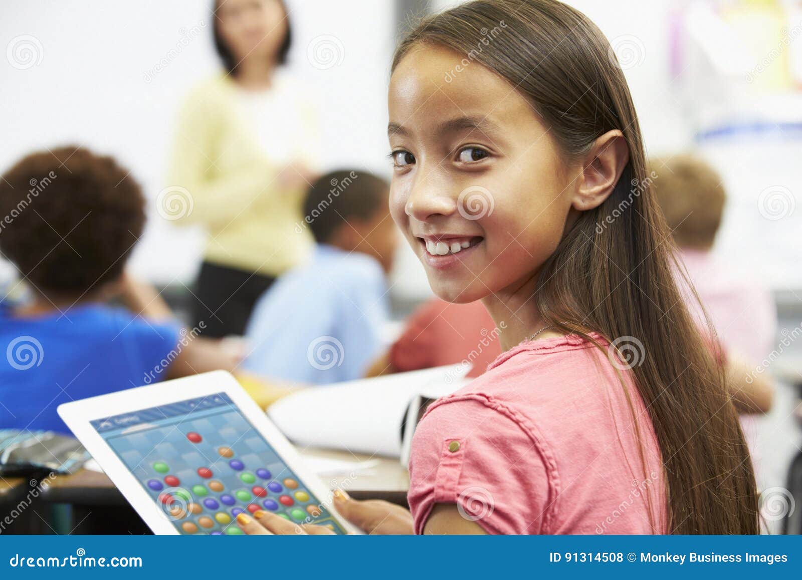 Pupil in Class Playing a Game on a Tablet Stock Photo - Image of ...