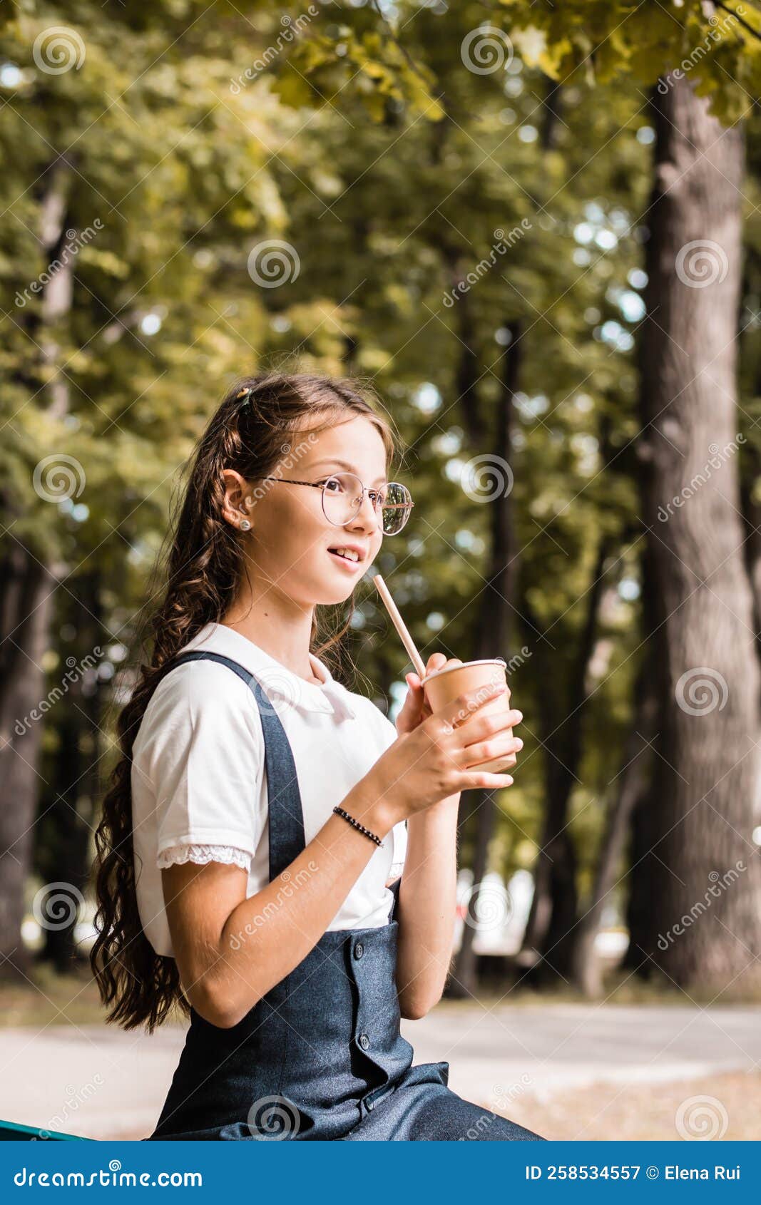 A Pupil In Eyeglasses Drinks A Beverage From An Eco Paper Cup With A