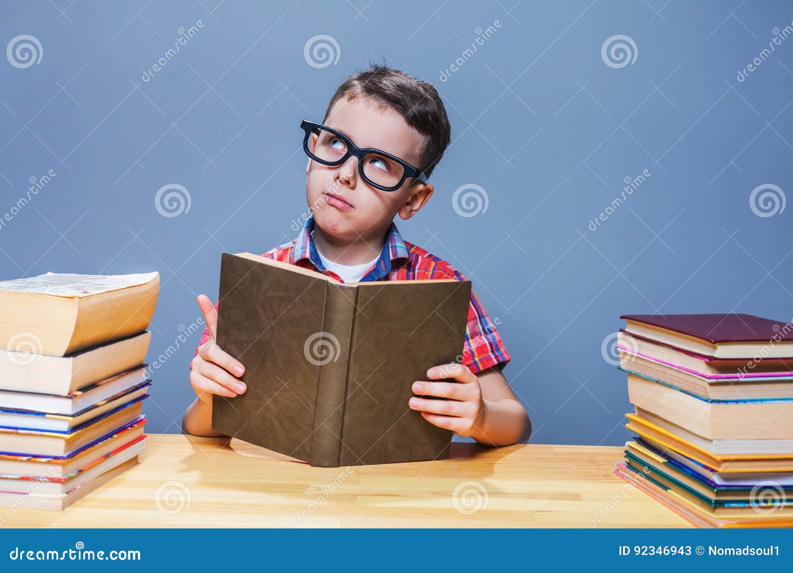 Pupil in Glasses Getting Knowledge from a Textbook Stock Image - Image ...