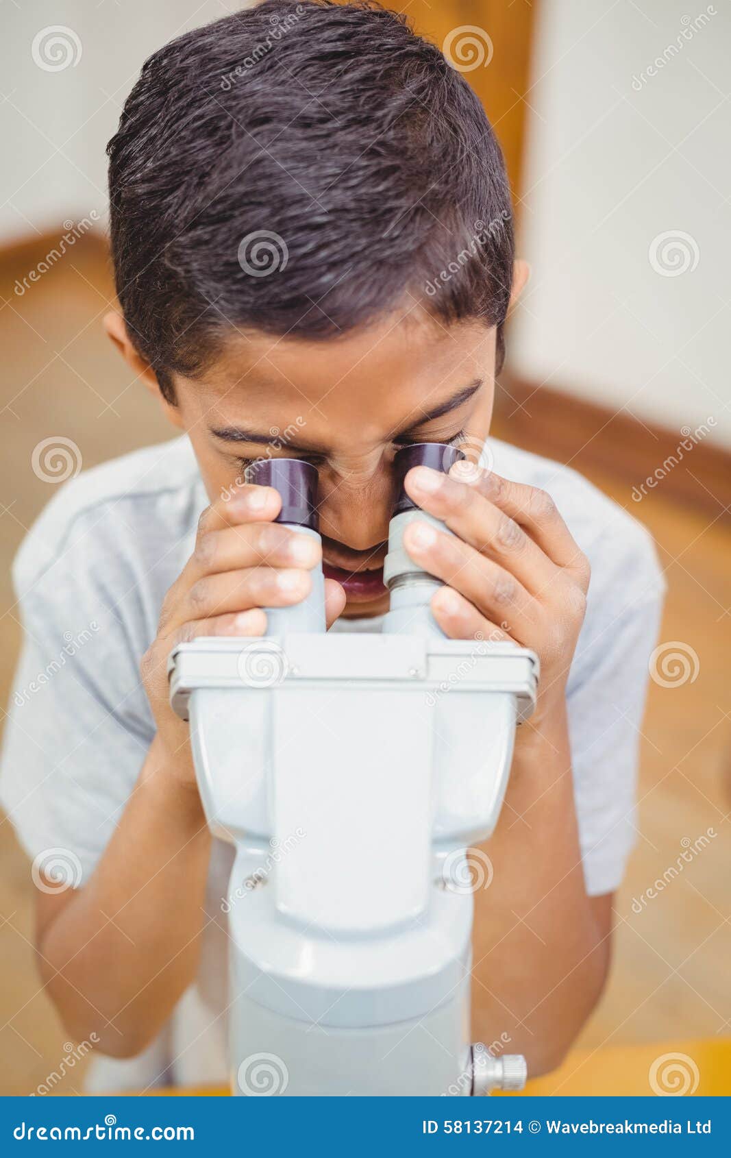 Pupil Looking through Microscope in Class Stock Photo - Image of ...