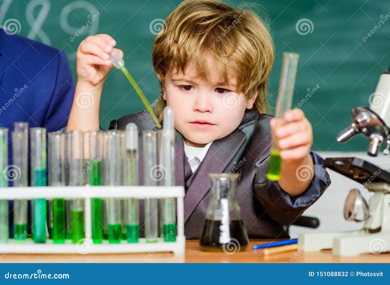 Pupil Looking at Testing Tubes in the Elementary School. Kid in Lab ...