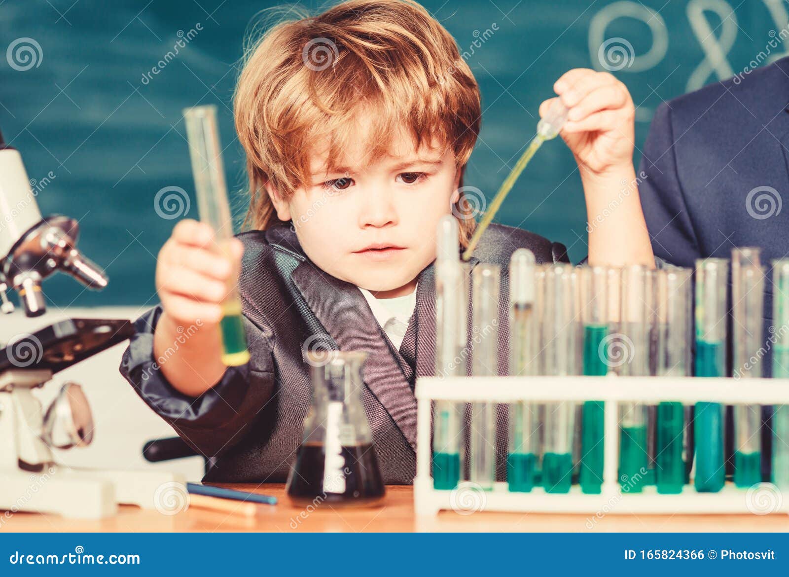 Pupil Looking at Testing Tubes in the Elementary School. Kid in Lab ...