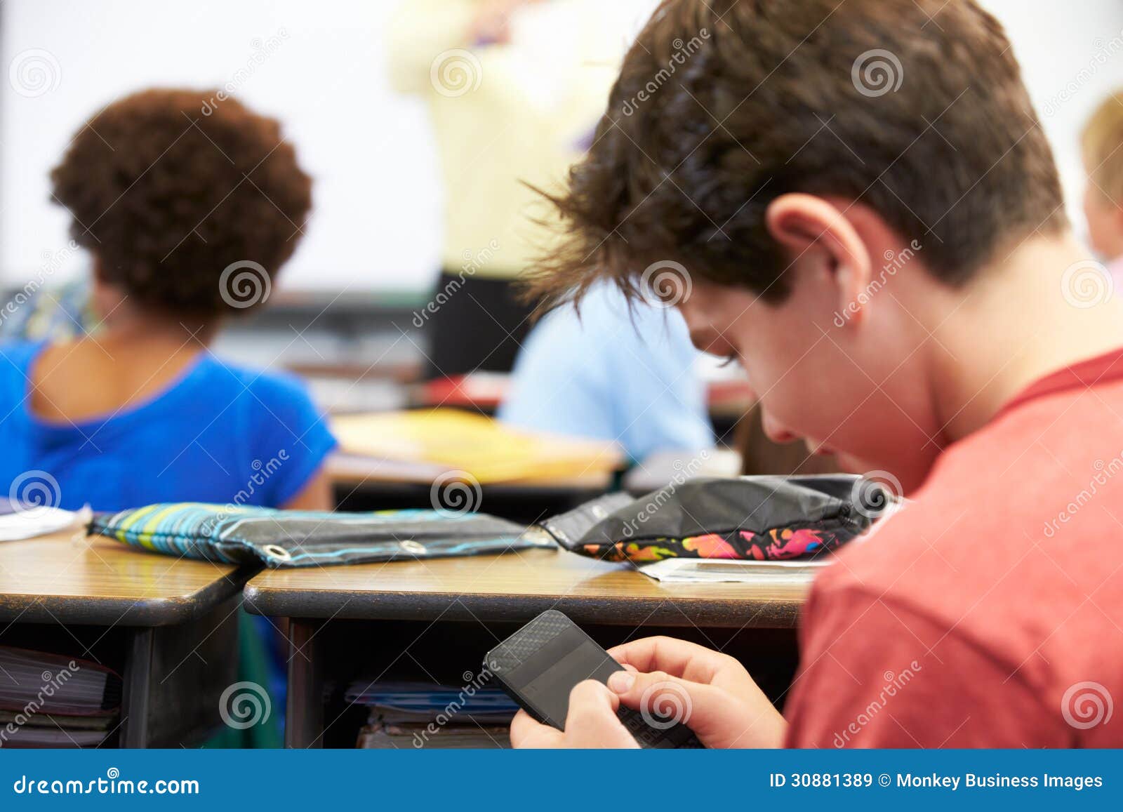 Pupil Sending Text Message on Mobile Phone in Class Stock Image - Image ... Pupil Sending Text Message on Mobile Phone in Class Stock Image - Image ...
