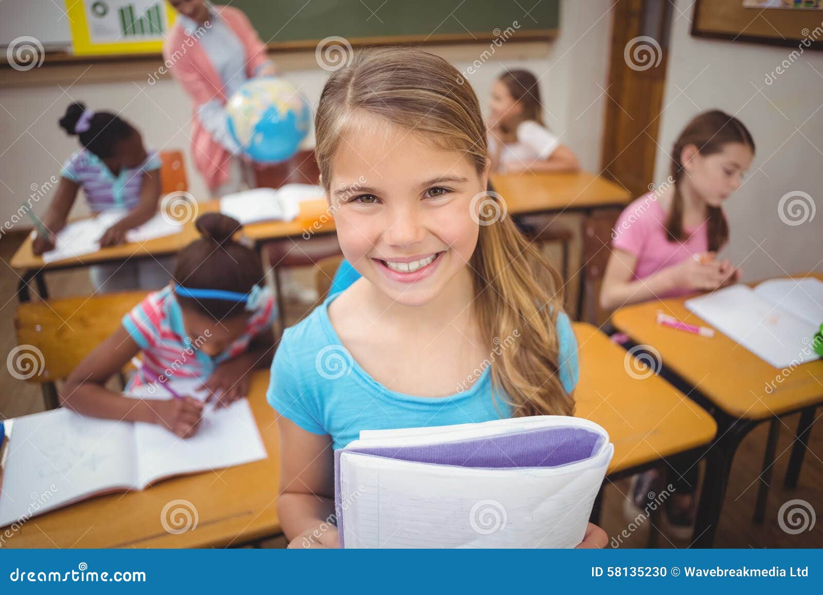 Pupil Showing Her Work To Camera Stock Photo - Image of class ...