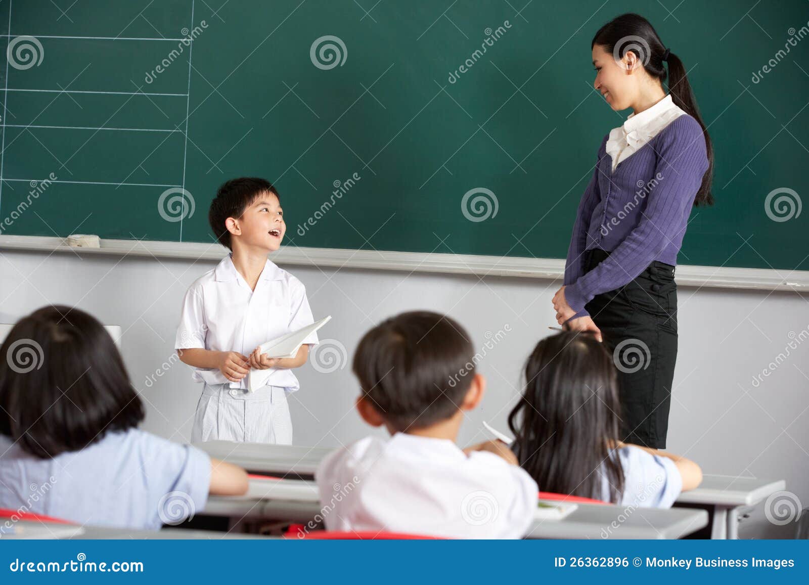 Pupil and Teacher in a Chinese School Stock Photo - Image of sitting ...