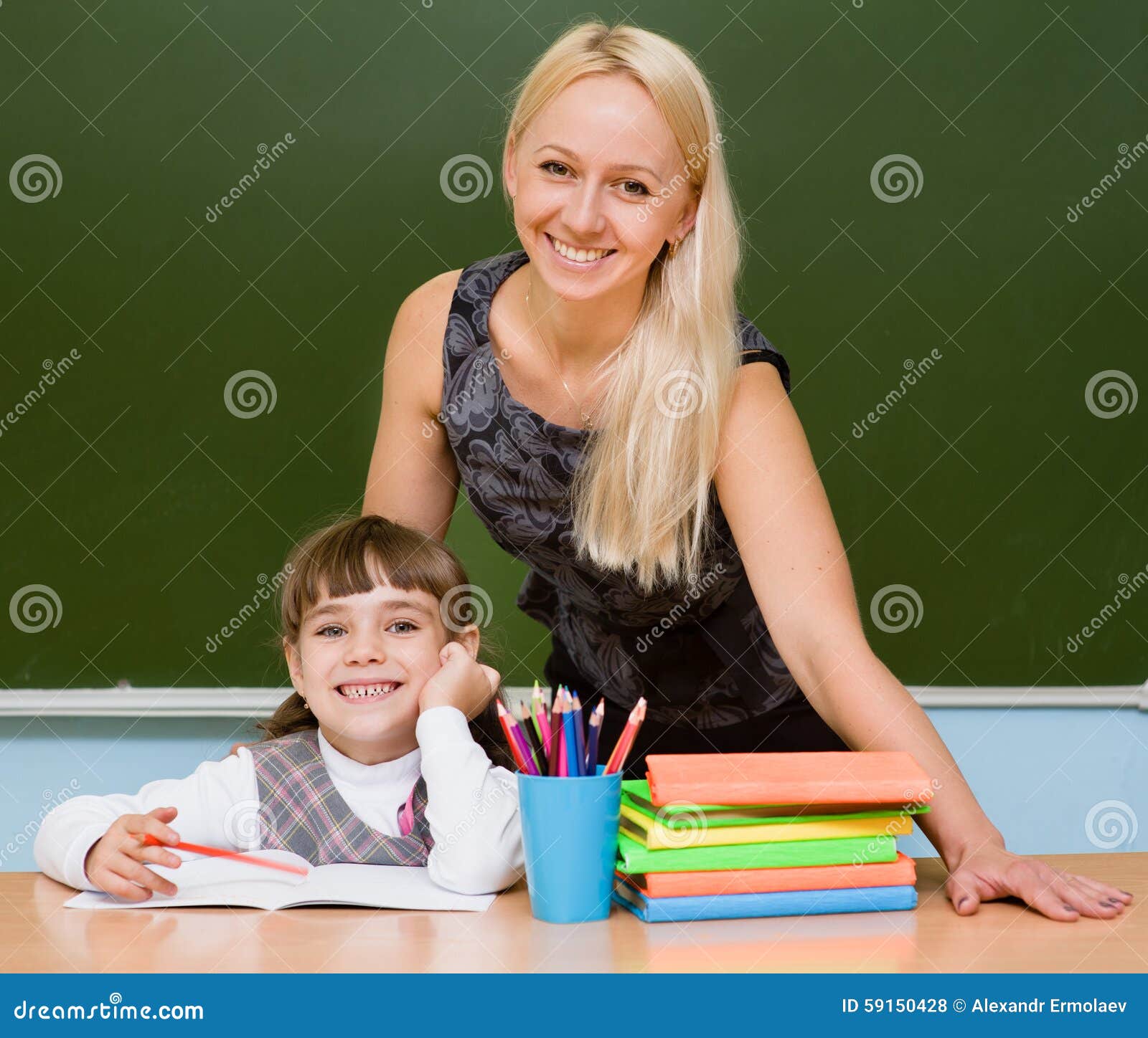 Pupil and Teacher in Classroom Near Chalkboard Stock Photo - Image of ... Pupil and Teacher in Classroom Near Chalkboard Stock Photo - Image of ...