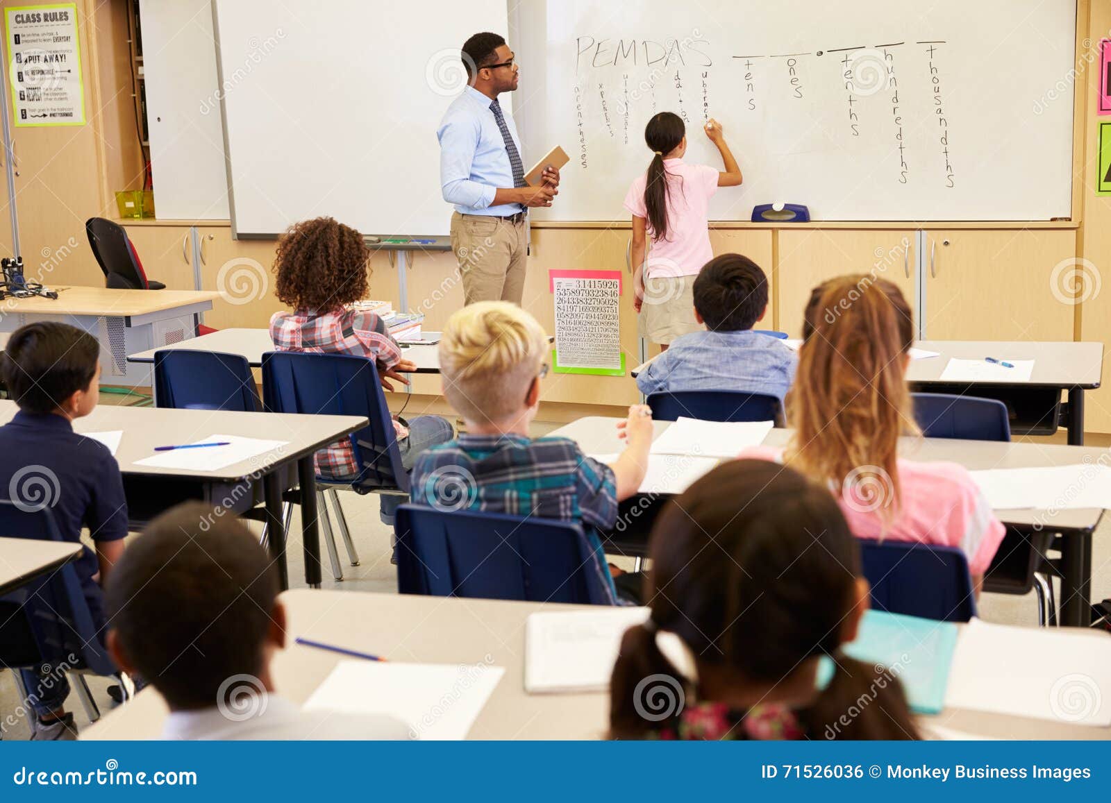 Pupil Writing on the Board at an Elementary School Class Stock Photo ...