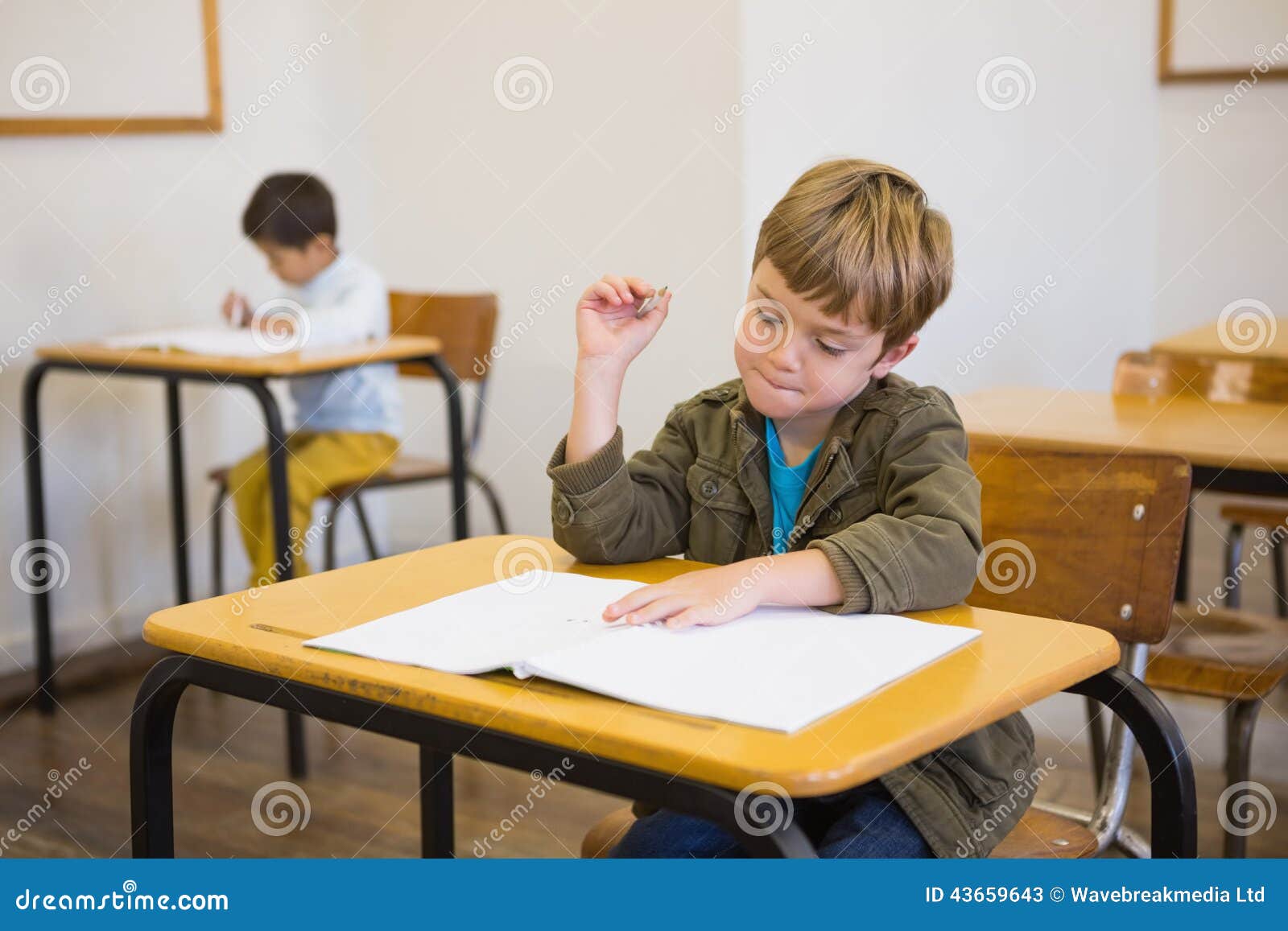 Pupil Writing in Notepad at His Desk Stock Image - Image of learning ...