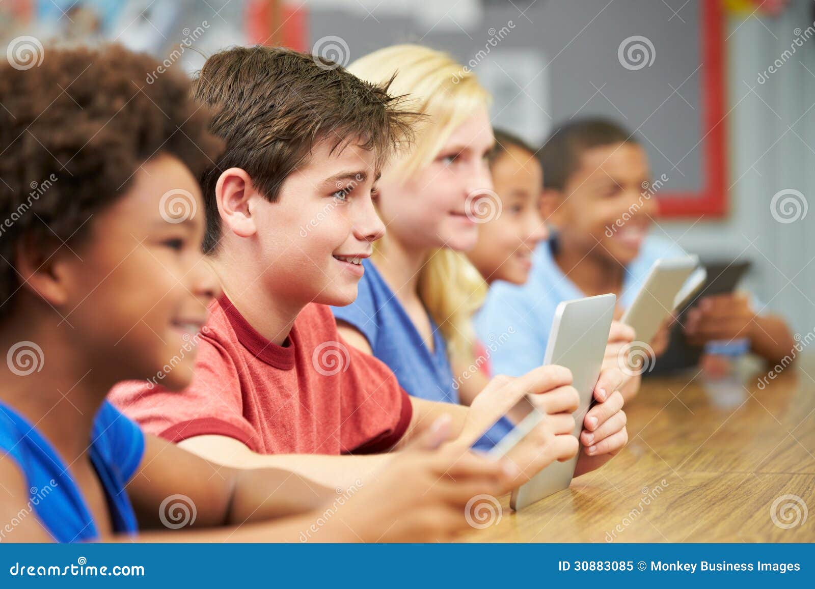 Pupils in Class Using Digital Tablet Stock Image - Image of sitting ...