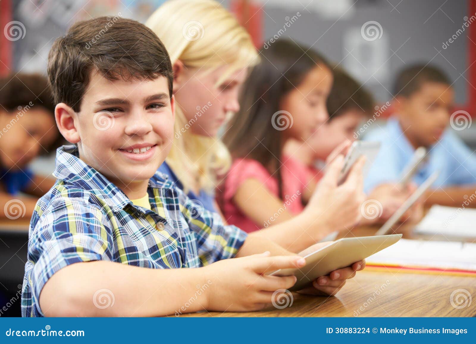 Pupils in Class Using Digital Tablet Stock Photo - Image of looking ...