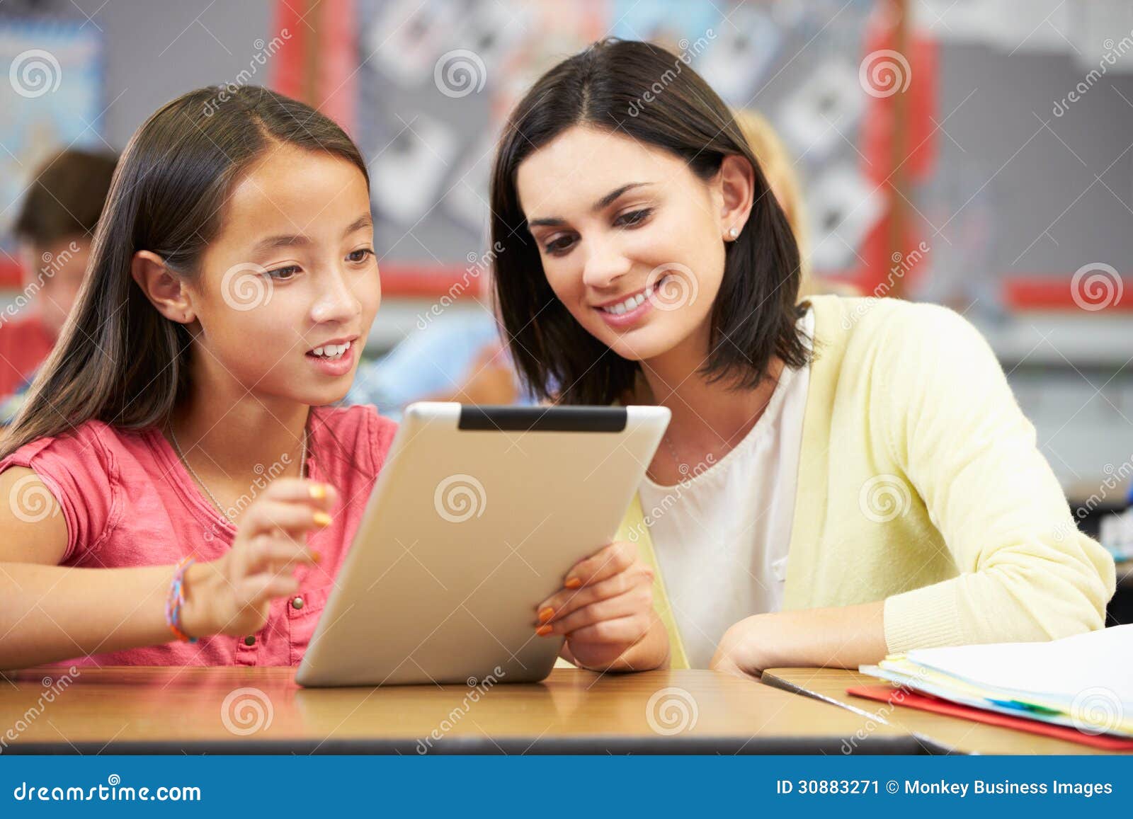 Pupils in Class Using Digital Tablet with Teacher Stock Image - Image ...
