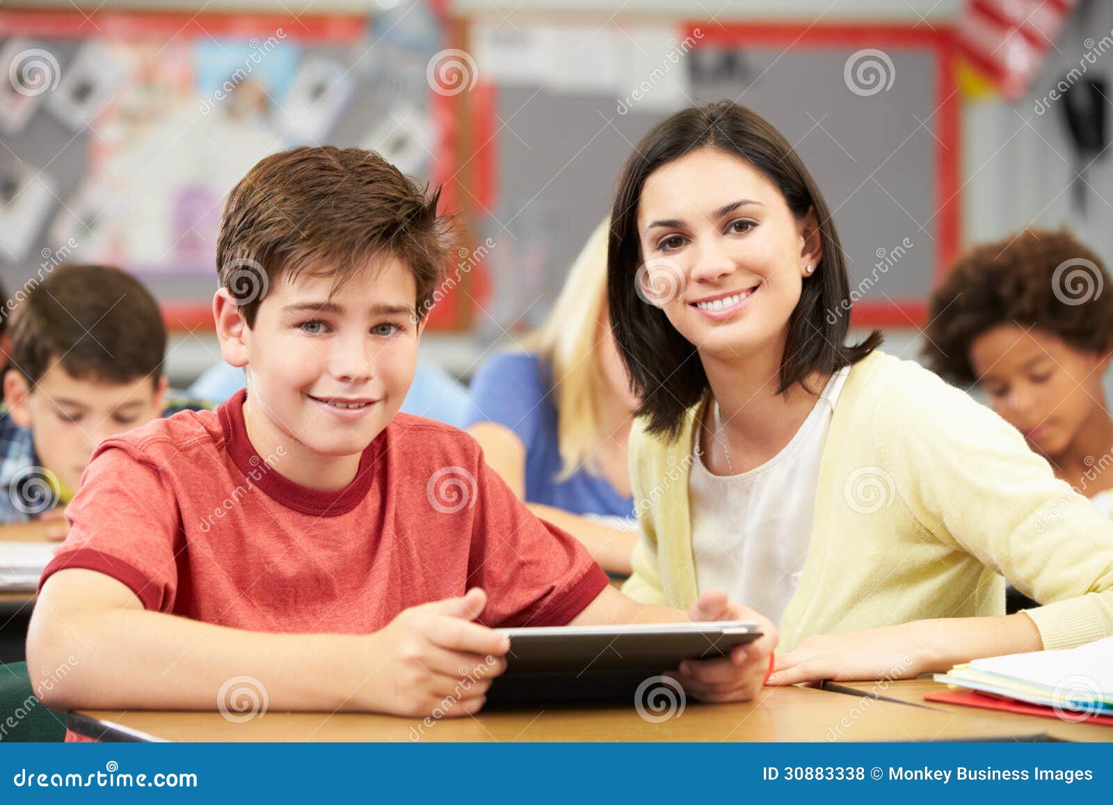 Pupils in Class Using Digital Tablet with Teacher Stock Photo - Image ...