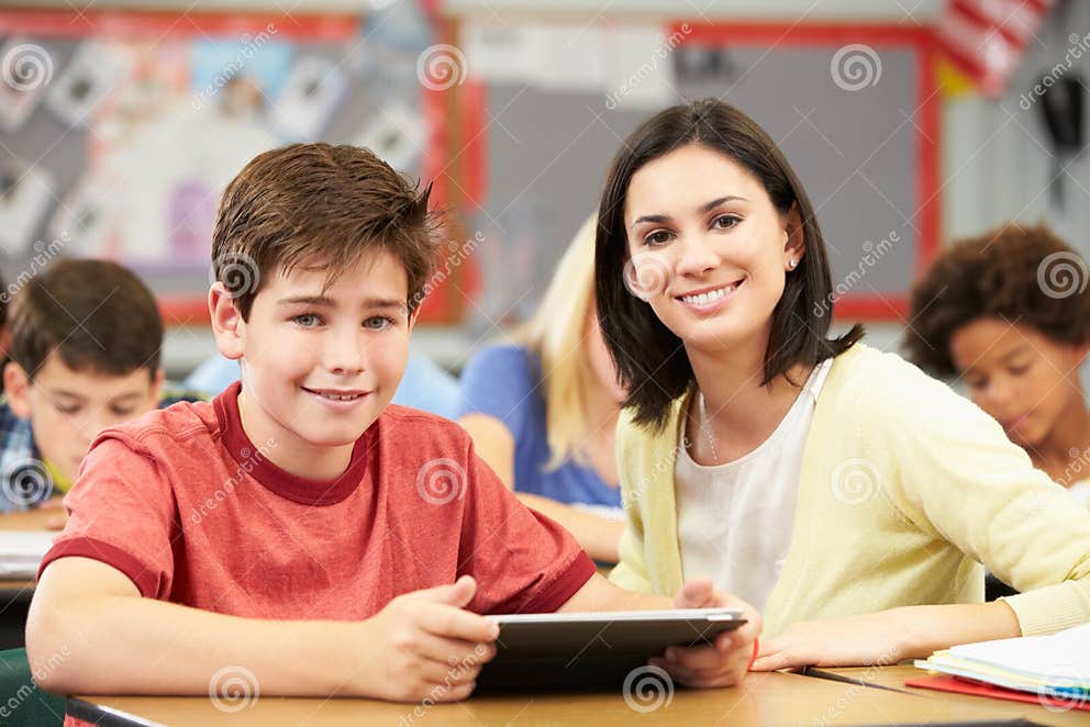 Pupils in Class Using Digital Tablet with Teacher Stock Photo - Image ...