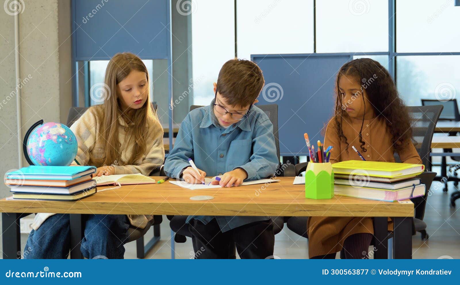 Pupils of Elementary Class Doing Homework. Kids Learning To Read and ...