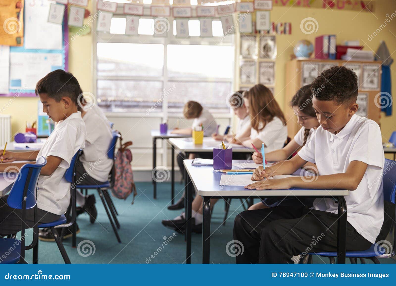 Pupils in a Lesson at a Primary School Classroom, Side View Stock Photo ...