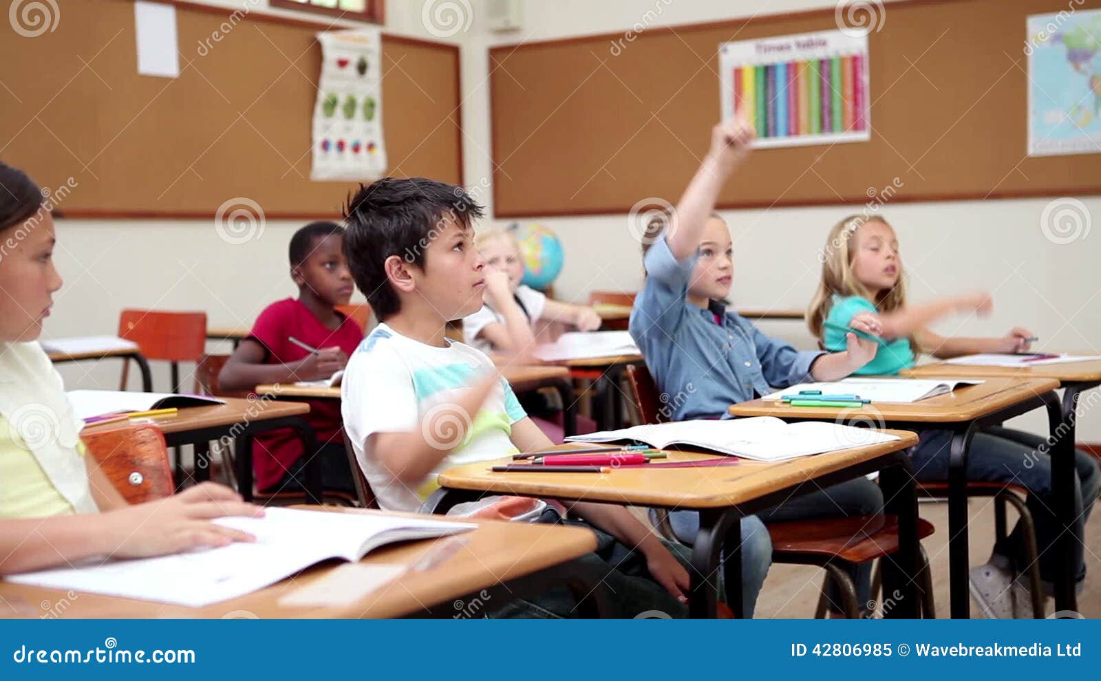 Pupils Raising Their Arms Together Stock Video - Video of classroom ...