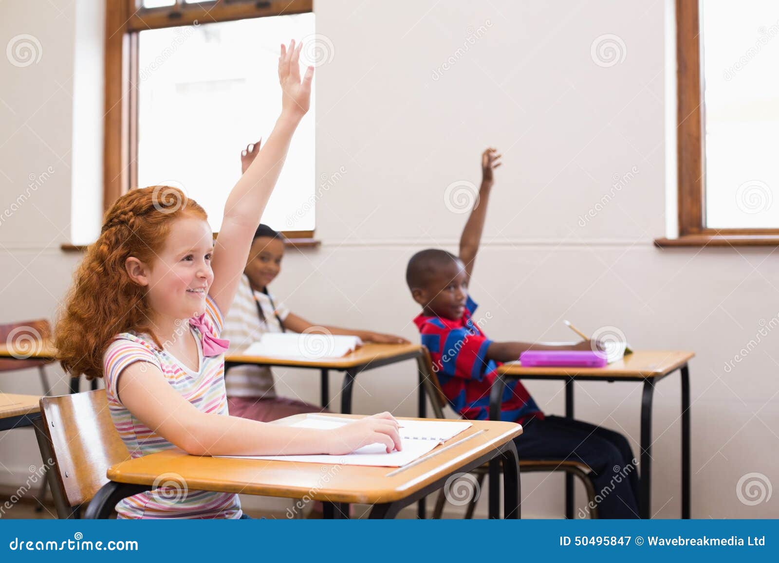 Pupils Raising Their Hands during Class Stock Image - Image of ...