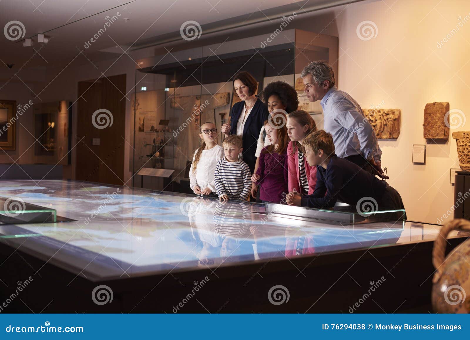 Pupils on School Field Trip To Museum Looking at Map Editorial Stock ...