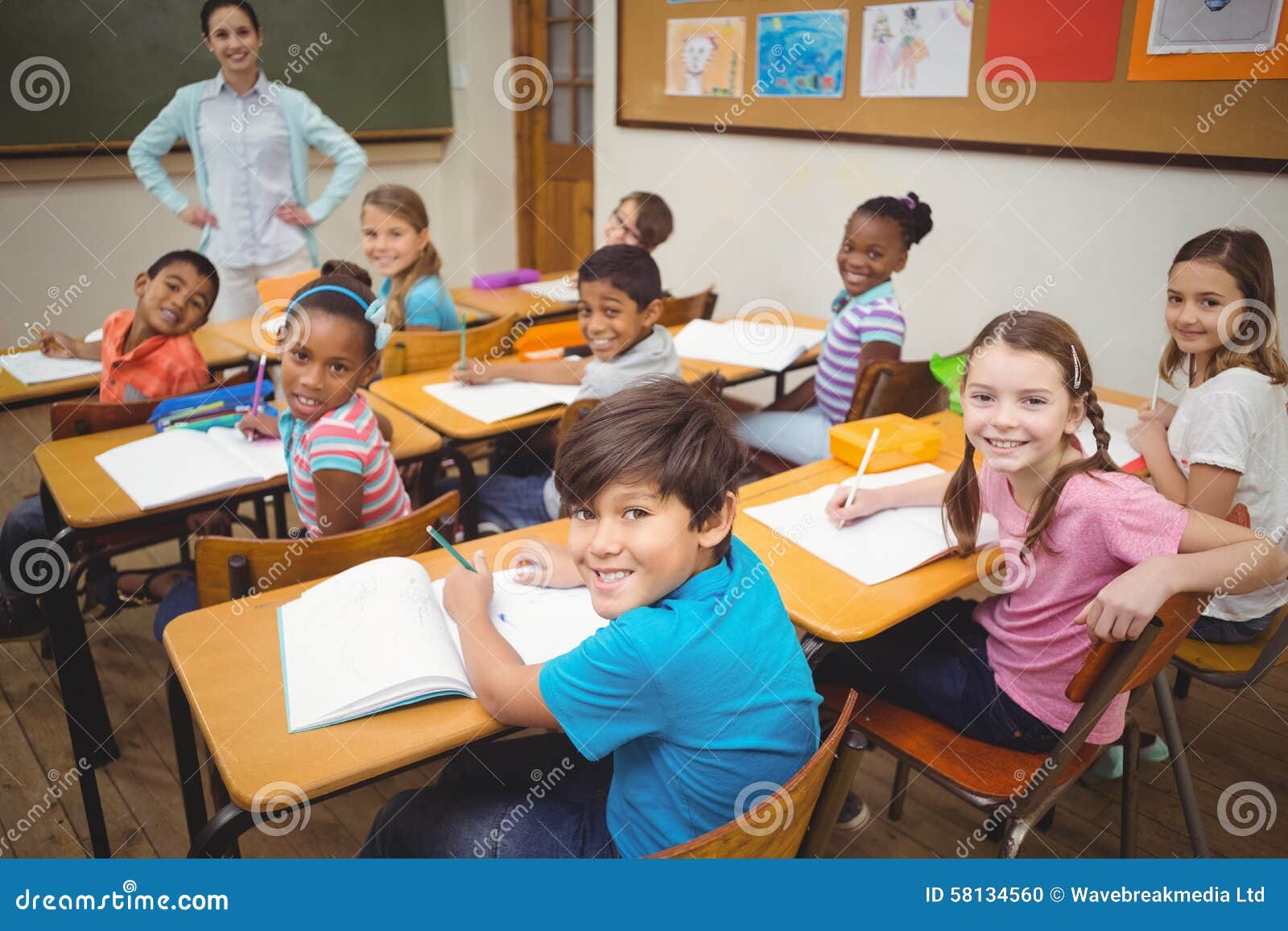 Pupils Smiling at Camera during Class Stock Photo - Image of indoors ...