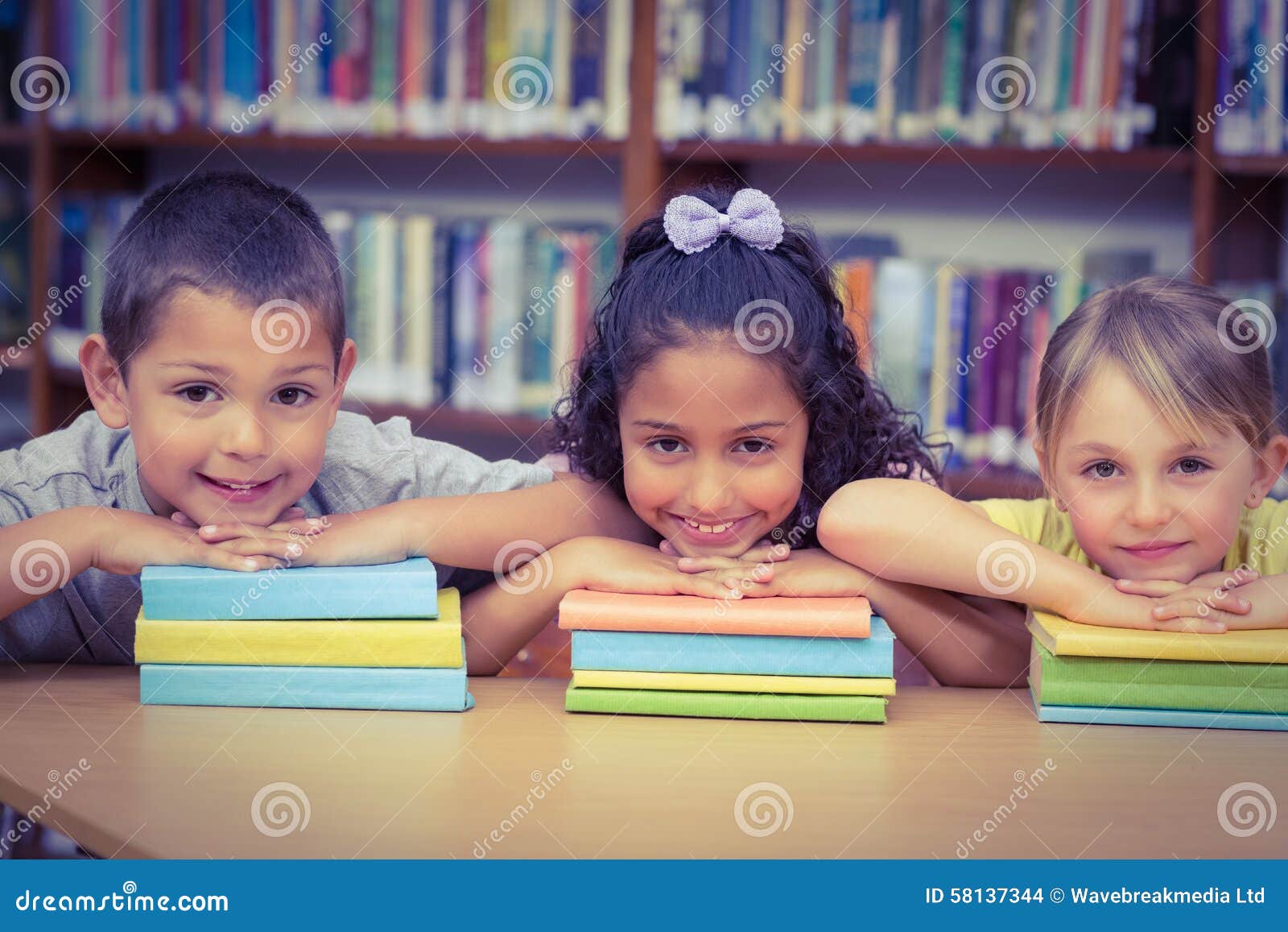 Pupils Smiling at Camera in Library Stock Photo - Image of school ...