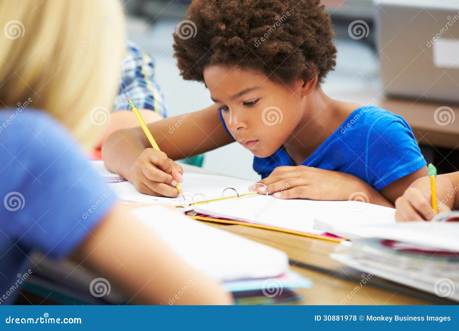 Pupils Studying at Desks in Classroom Stock Photo - Image of student ...