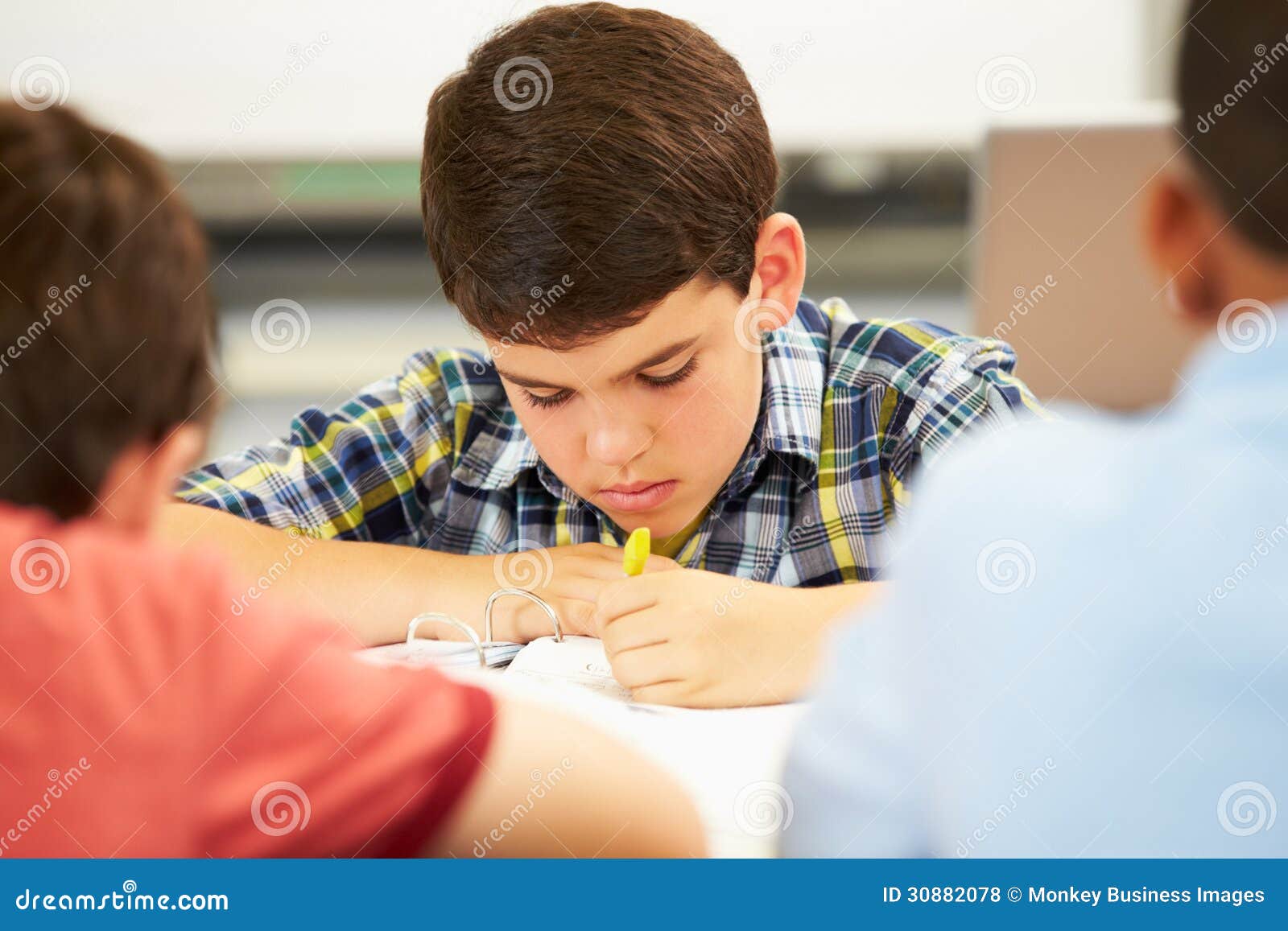 Pupils Studying at Desks in Classroom Stock Photo - Image of learning ...