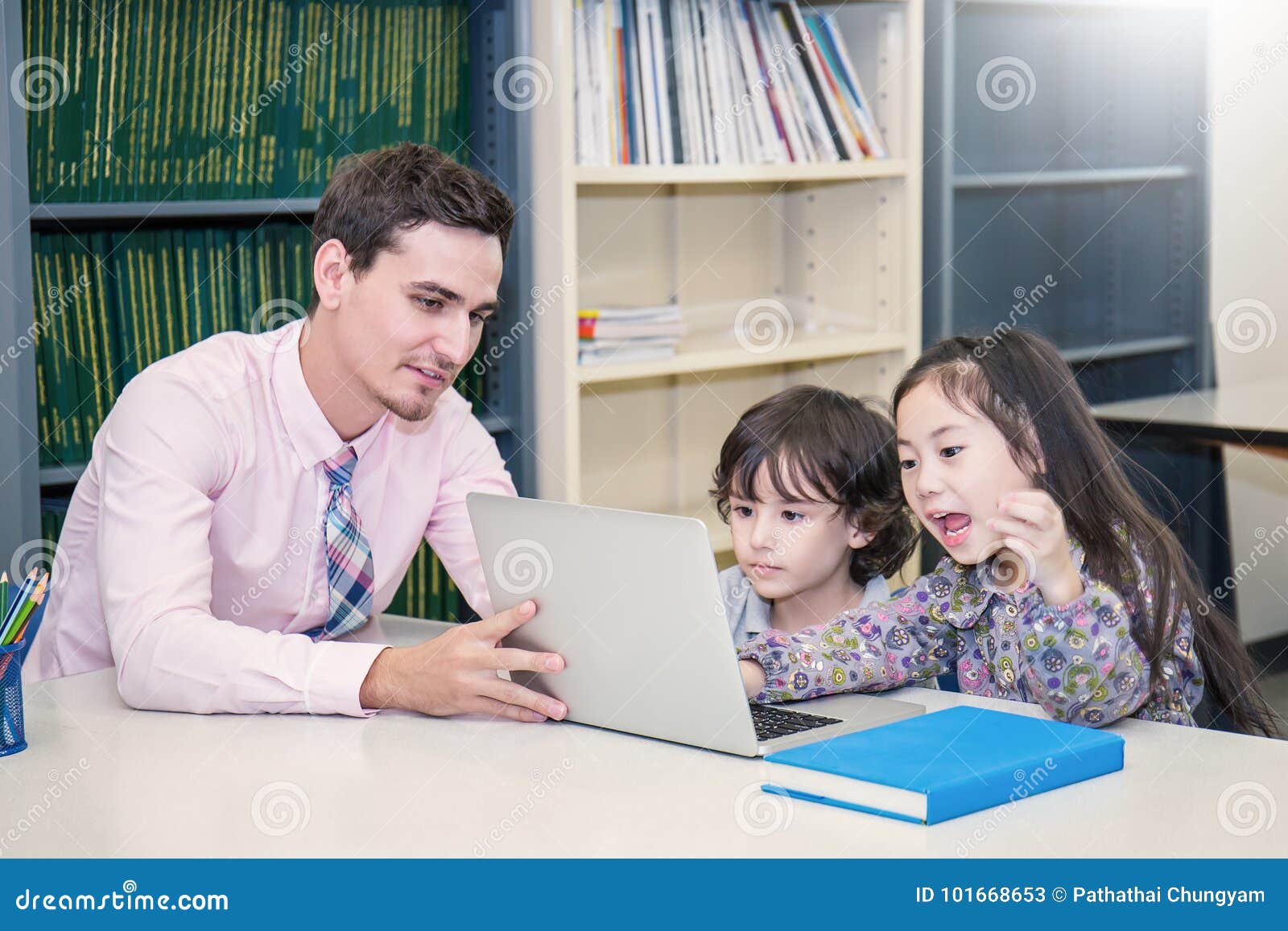 Pupils Studying with Teacher Using Computer Device in Classroom Stock ...