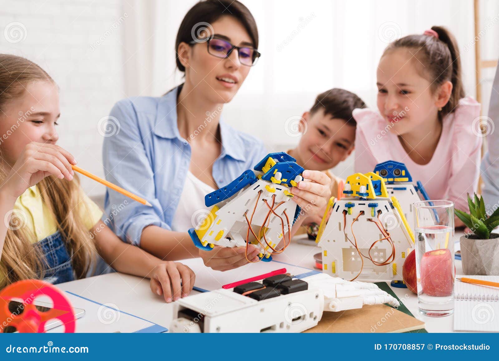 Pupils and Teacher Constructing Robots Together in Class Stock Image ...