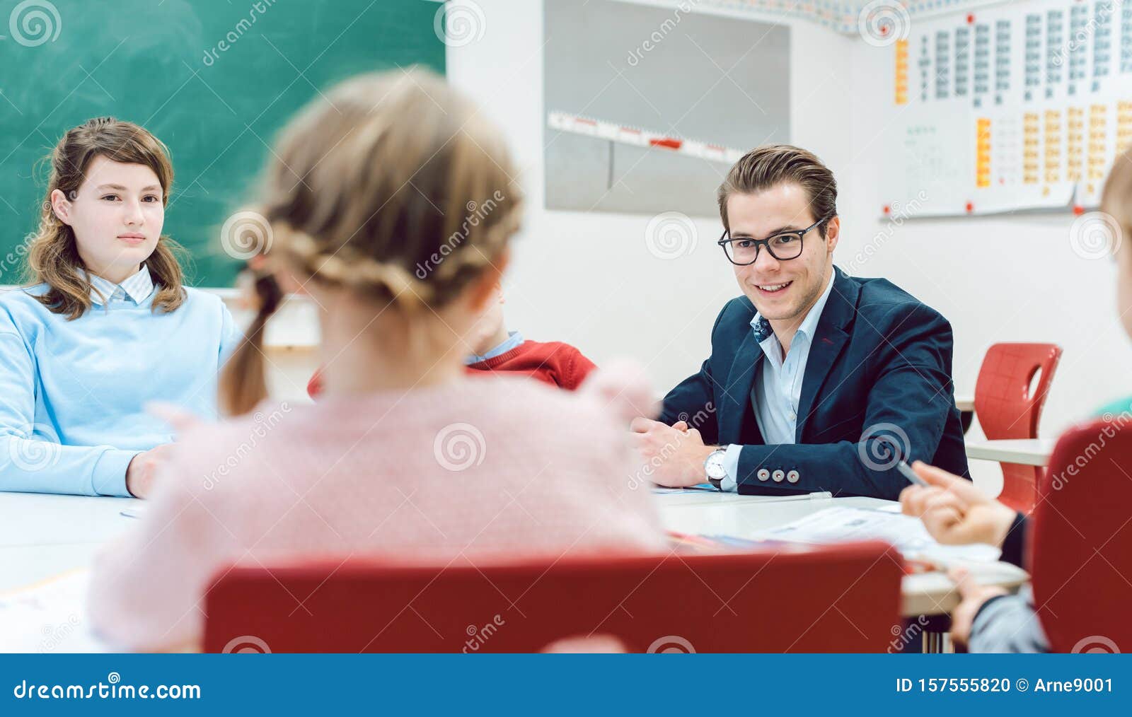Pupils and Teacher Cooperating in Teamwork Exercise Stock Photo - Image ...