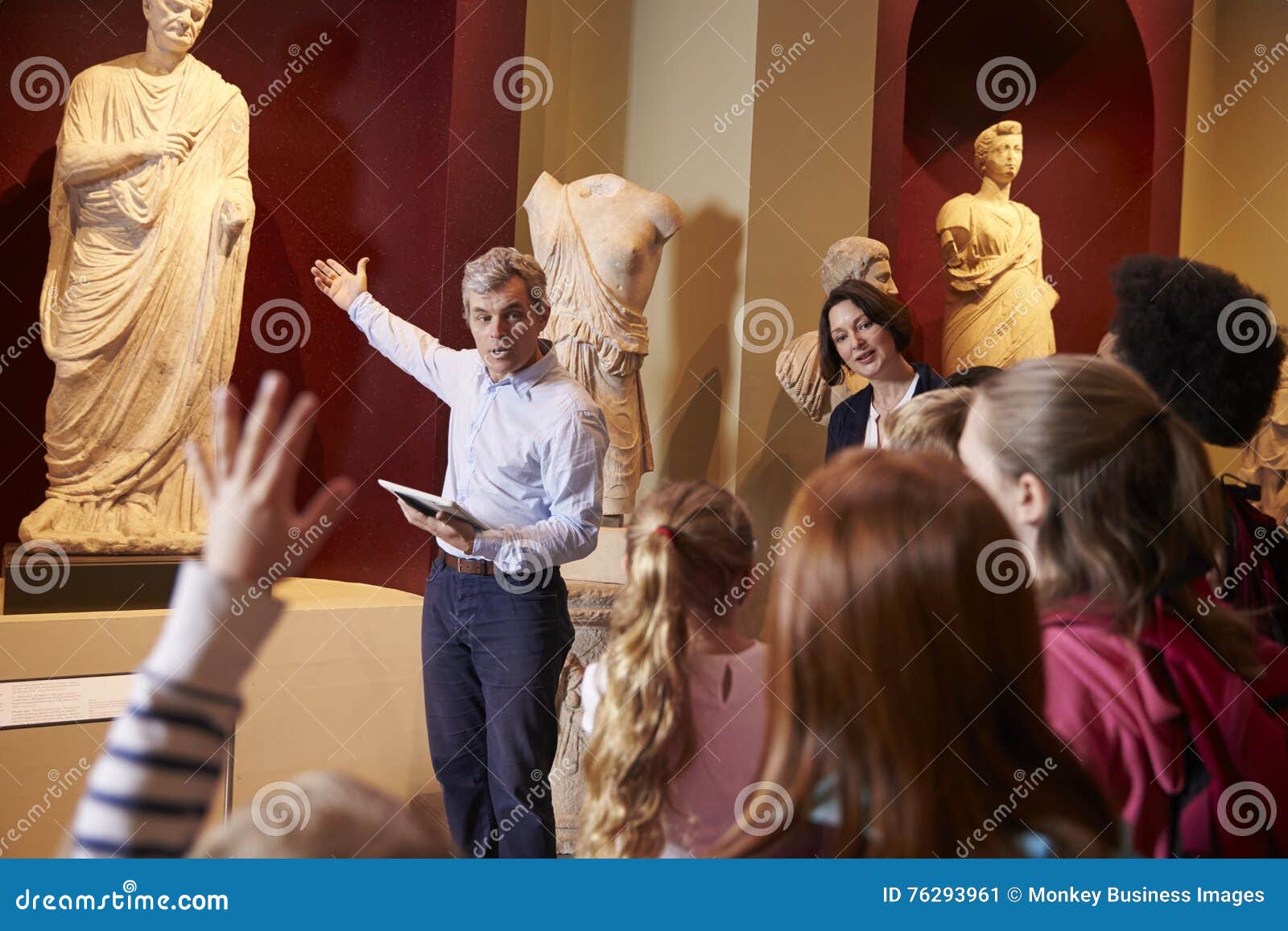 Pupils and Teacher on School Field Trip To Museum with Guide Editorial ...
