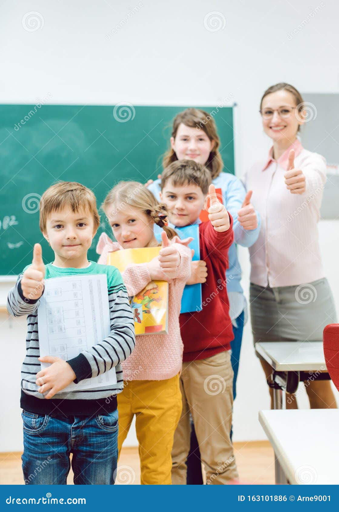 Pupils and Teacher Showing Thumbs-up in School Having Fun Stock Photo ...