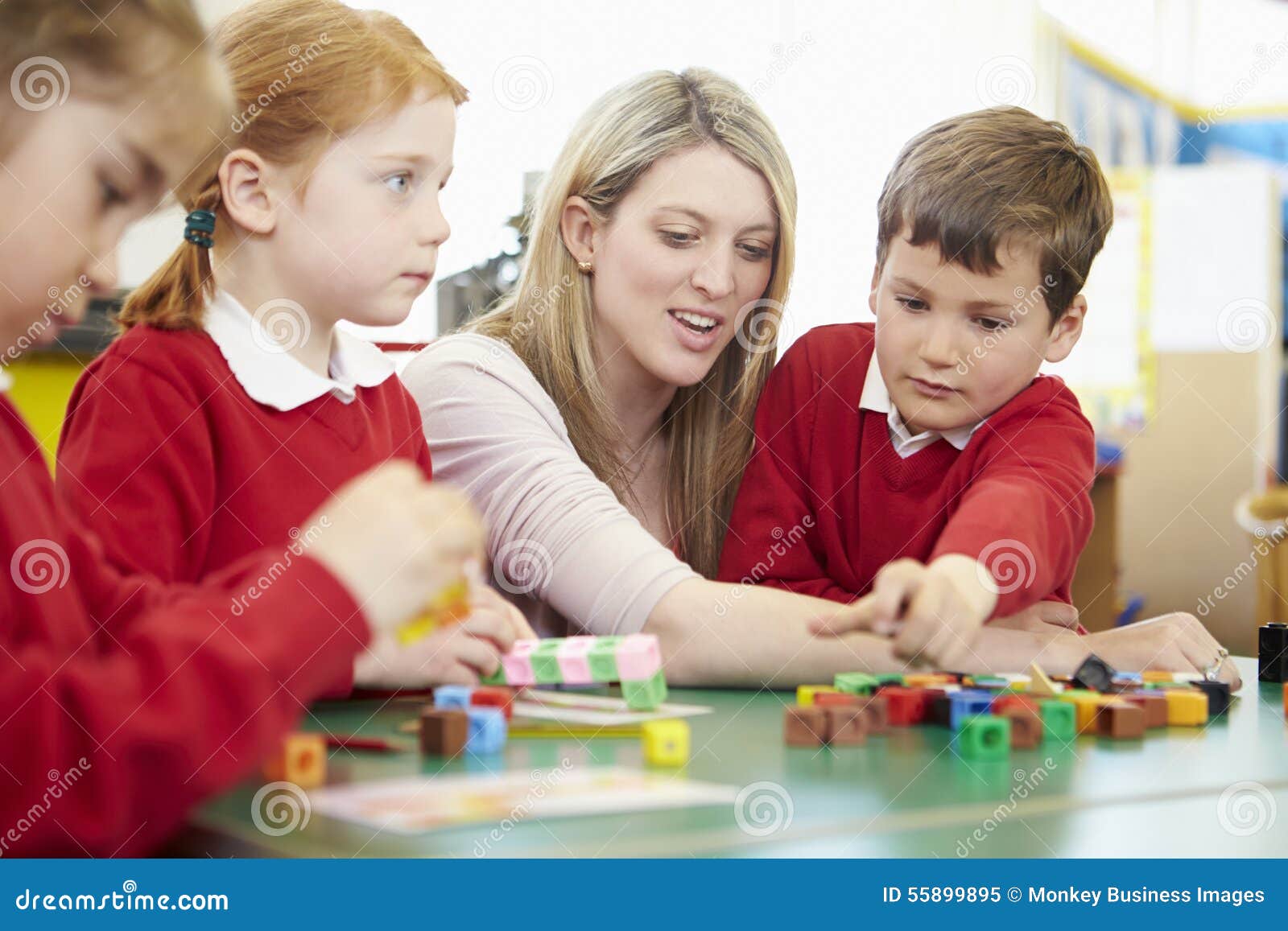 Pupils and Teacher Working with Coloured Blocks Stock Image - Image of ...