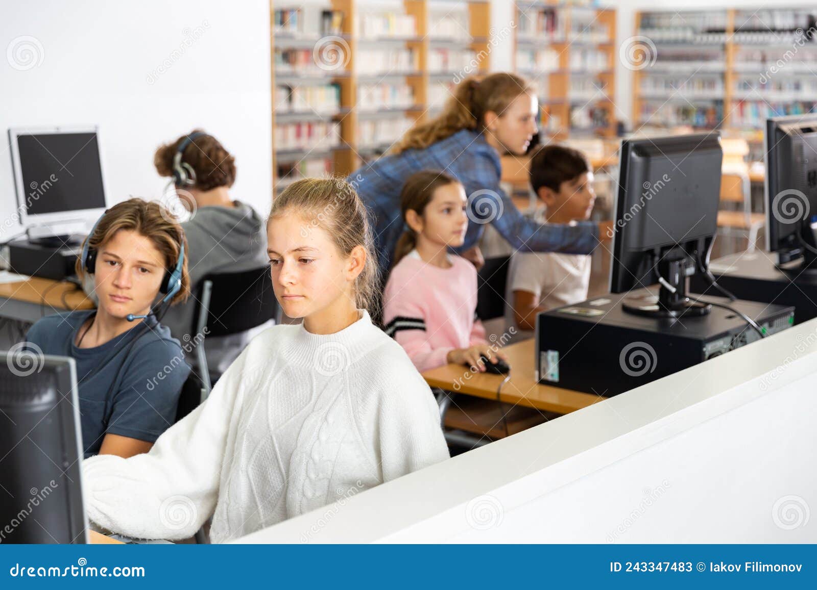 Pupils Using Computers at Lesson, Teacher Teaching Them in Class Room ... Pupils Using Computers at Lesson, Teacher Teaching Them in Class Room ...
