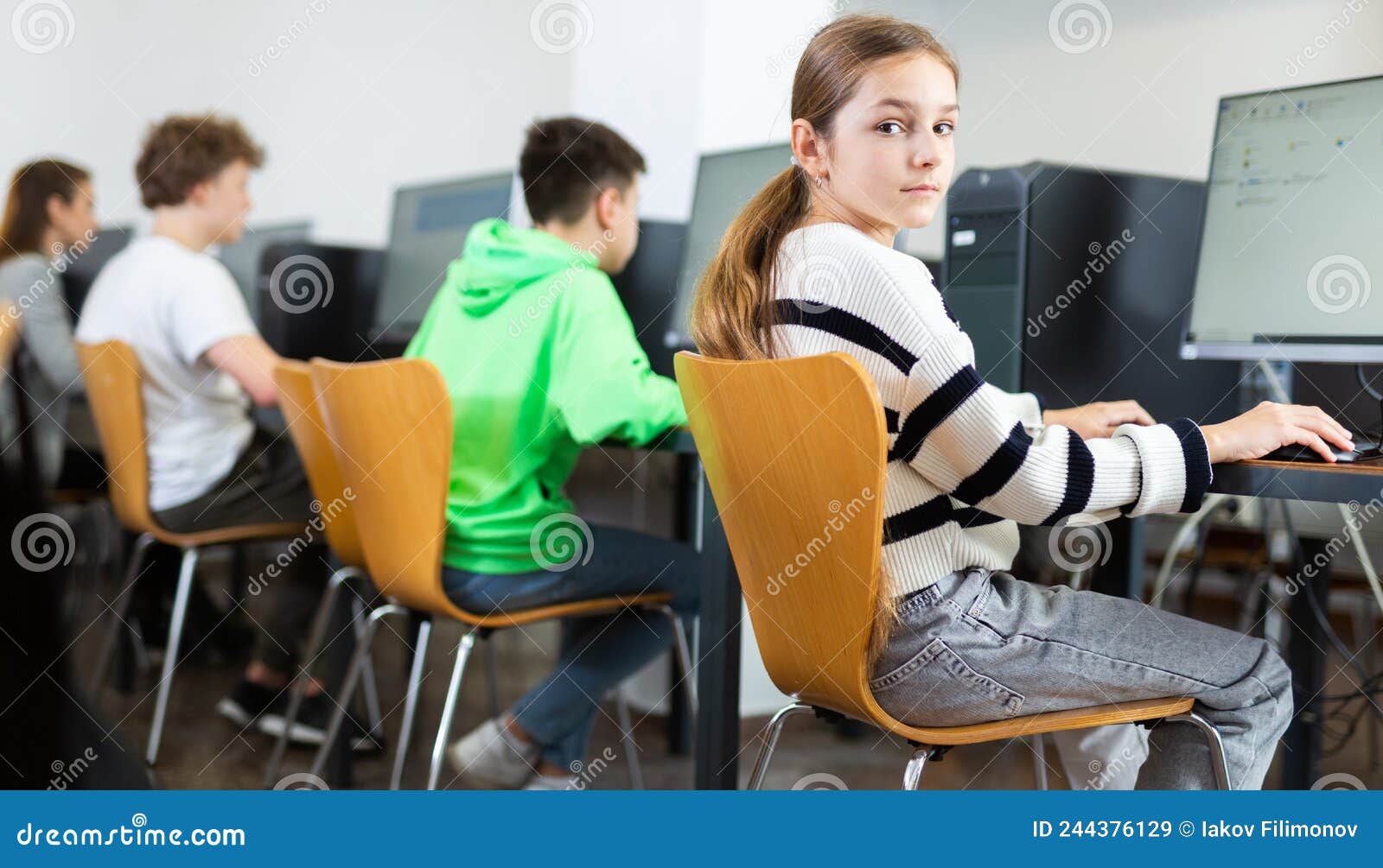 Pupils Using Computers at Lesson, Teacher Teaching Them in Class Room ... Pupils Using Computers at Lesson, Teacher Teaching Them in Class Room ...